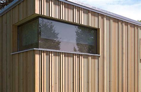 A Wooden Building With A Window On The Side