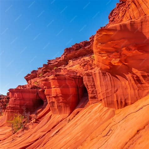 Premium Ai Image Vibrant Red Sandstone Cliffs Carved By The Forces Of