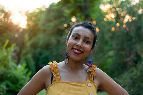 Premium Photo Smiling Young Latin Girl In Dress