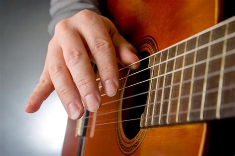 Premium Photo Man Plays The Classical Guitar String Musical