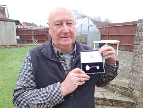 King Charles Presents Elizabeth Emblem To Son Of Fireman Leslie Pearce