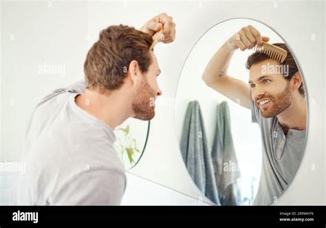 Bathroom Mirror Reflection And Happy Man Brush Hair For Growth