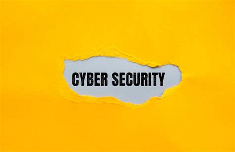 Cyber Security Message Written On Ripped Yellow Torn Paper With Gray