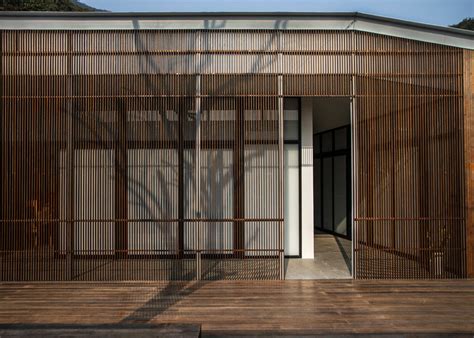 Bricks Give A Perforated Facade To Mountain Building By Li Xiaodong