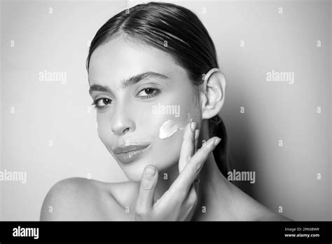 Beautiful Woman Spreading Cream On Her Face Skin Cream Concept Facial