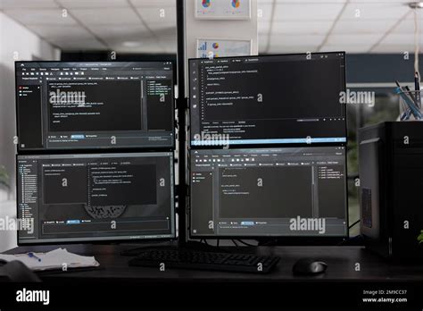 Computer Monitors On Desk Compiling Programming Html Data Algorithms In