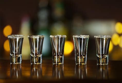 Premium Photo Empty Shot Glasses On Bar Counter