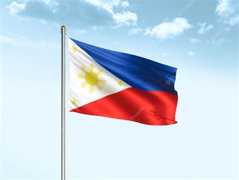 Premium Photo Philippines National Flag Waving In Blue Sky With