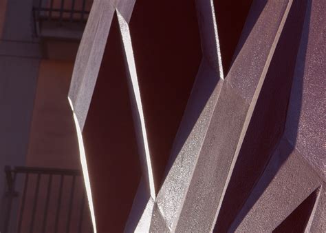 Gg Loop Transforms Italian House With Red Faceted Facade