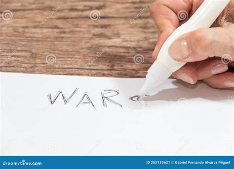 Hand Correcting Writings Of A Notebook With Liquid Paper Stock Image