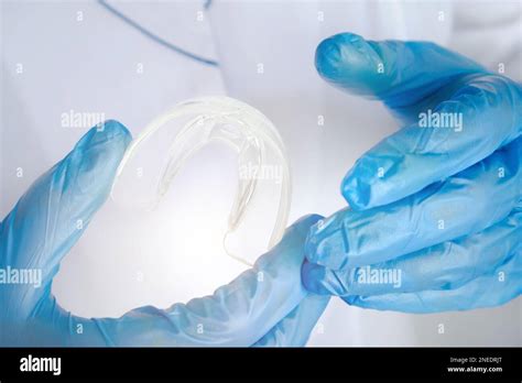 Dental Care Removable Clear Braces Aligner In Doctors Hand Orthodontic Silicone Trainer