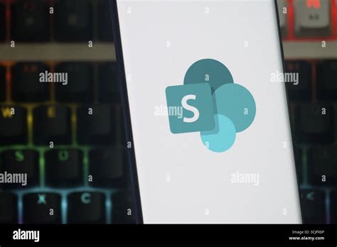 Sharepoint App Logo With Blue And Green Circles On A Smartphone Screen