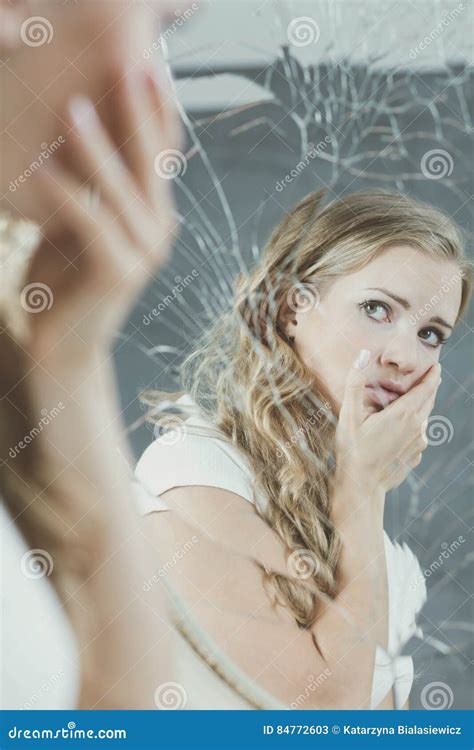 Depressed Girl Looking In Mirror