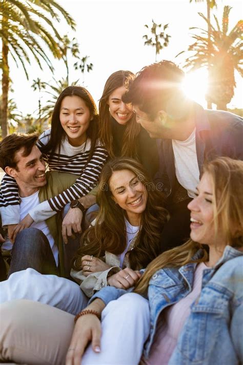 Vertical Shot Of Young Group Of Friends Having Fun Together At City
