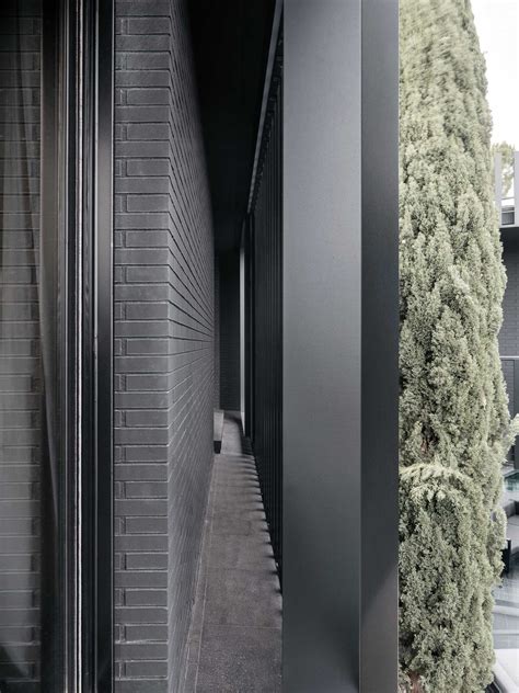 Vertical Fins Surround The Exterior Of This House Giving It A Distinct