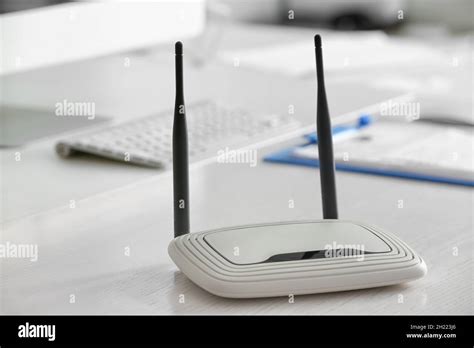 Modern Wi Fi Router On Table In Office Stock Photo Alamy