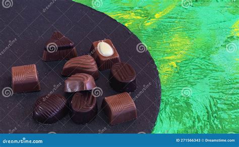 Variety Of Assorted Flavors Chocolate Candies On Stone Plate Stock