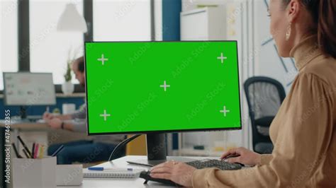 Close Up Of Woman Using Computer With Isolated Green Screen On Display Company Worker Looking