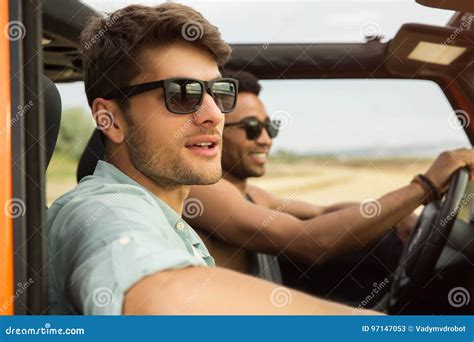 Smiling Young Male Friends Driving A Car Stock Image Image Of Friends
