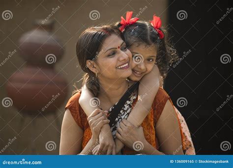 Portrait Of Loving Indian Mother And Daughter At Village Stock Image