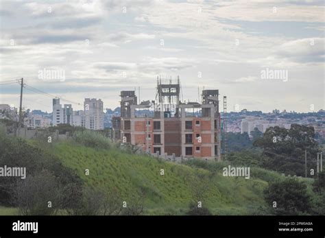 Construction In Progress With Grass Around The Landscape Of A City In