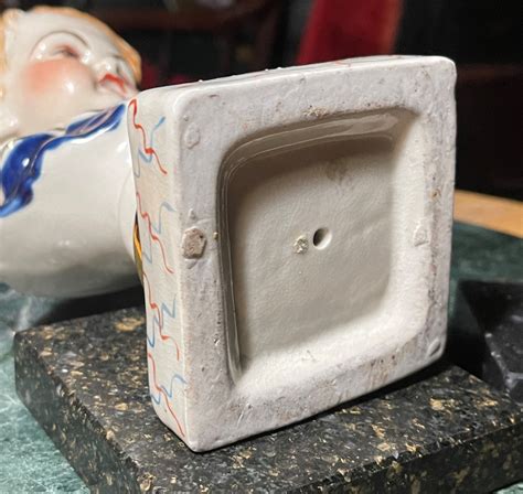 34 Bust Of A Cherubic Boy Glazed And Gilded Porcelain Collectors