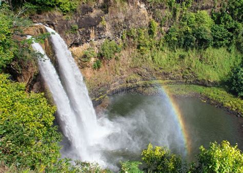 Waterfall In Kauai Hawaii With Rainbow Stock Image Image Of Lush