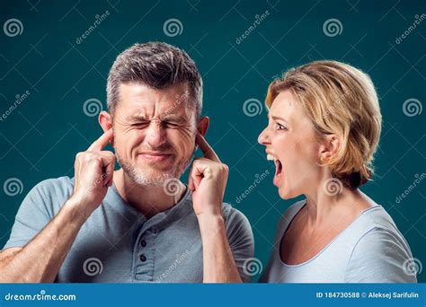 A Portrait Of Angry Couple Wife Screaming At Her Husband People And