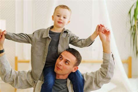 Dad Plays With His Son And Rolls Him On His Shoulders Stock Image Image Of Plays Shoulders