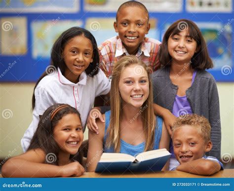 Sharing A Book In English Class Portrait Of A Group Of Students