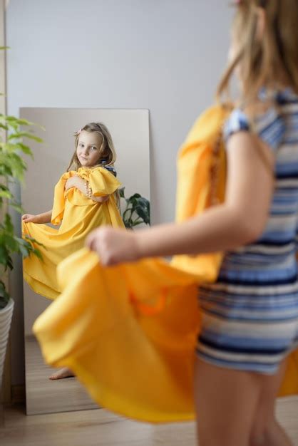 Premium Photo Girl Trying Dress At Home
