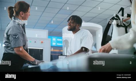 Security Checkpoint In Airport Diverse People Tourists Putting