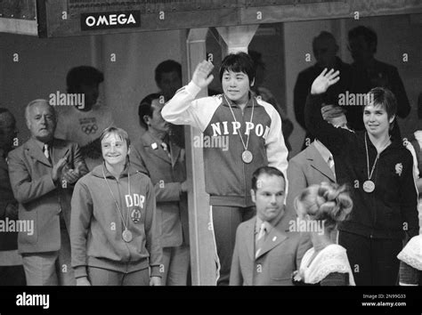 On The Podium At The Medal Awarding Ceremony Of The Womens 100 Meter
