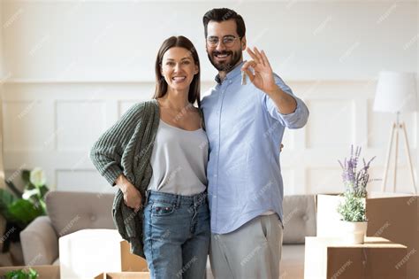 Premium Photo Portrait Of Young Affectionate Couple Embracing Showing
