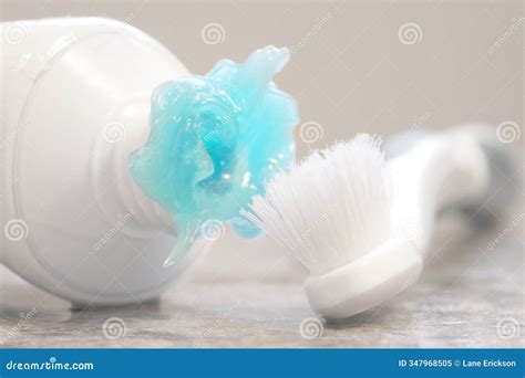 Worn Toothbrush And Messy Toothpaste Blue Gel For Brushing Teeth Stock
