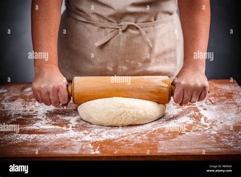 Housewife Flattening A Dough With A Rolling Pin Stock Photo Alamy
