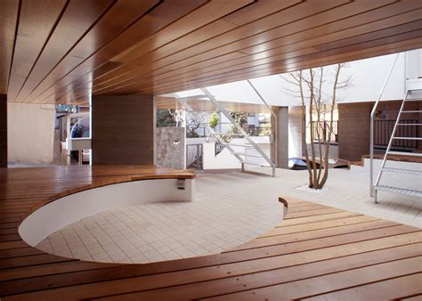 House By Kazuhiko Kishimoto With A Seating Deck And Gallery Underneath