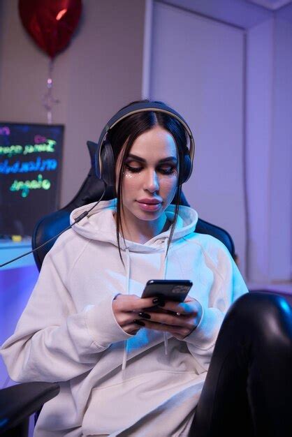 Premium Photo Happy Woman Putting On Headphones And Playing Computer