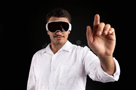 Young Businessman Using New Vision Pro Vr Glasses Headset Gesturing