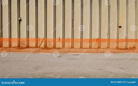 Safety Temporary Orange Plastic Netting Fence For Construction Industry In Front Of A Large