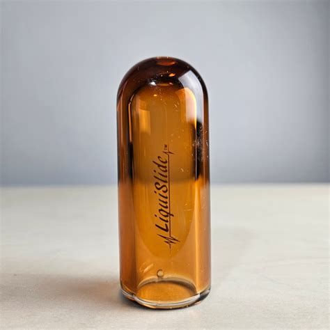The Liquislide Pinky Xs Sized Glass Guitar Slide Burnt Orange