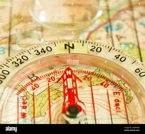 A Closeup View Of A Modern Compass On A Typical Map Within The United