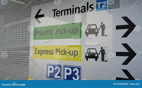 Airport Pick Up And Drop Off Area With Flight Information Display