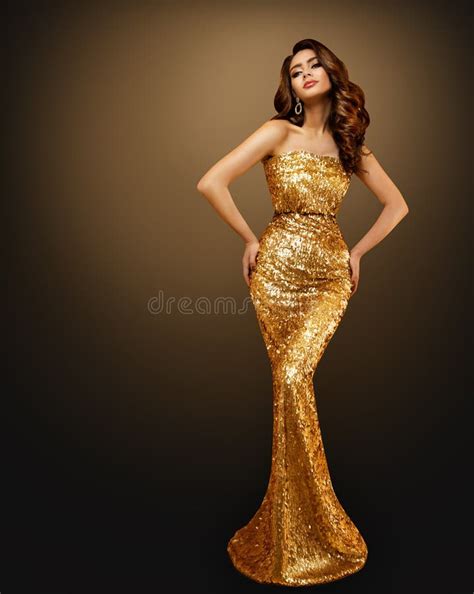 Woman In Black Mini Dress Over Gold Background Fashion Model With