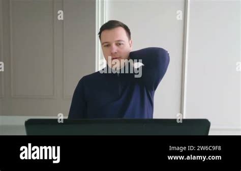 Freelancer Stretches Doing Light Exercises To Relieve Muscle Tension From Sedentary Work