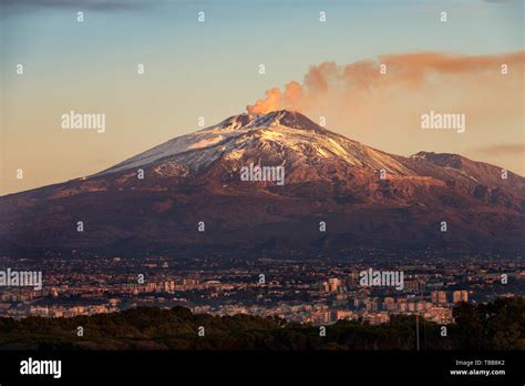 The Mount Etna Volcano With Smoke And The Catania City Sicily Island