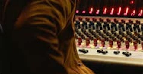 Vertical Video African American Sound Designer Operates Control Desk