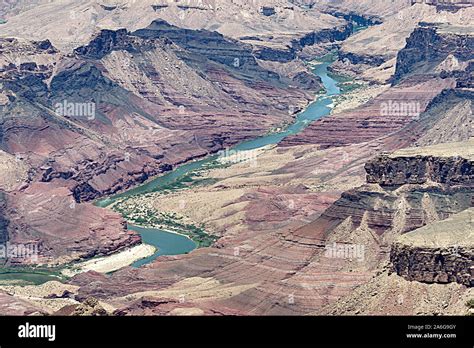 View From Above Of The Colorado River Winding Through The Grand Canyon
