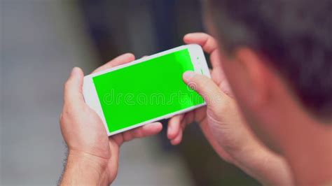 Man Scrolling Through Information On A Mobile Stock Video Video Of