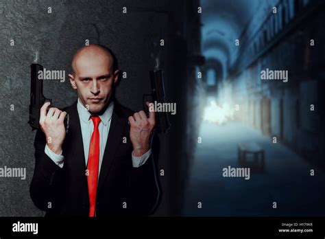 Contract Murderer Wallpaper Background Or Poster Concept Assassin In Suit And Red Tie Holding